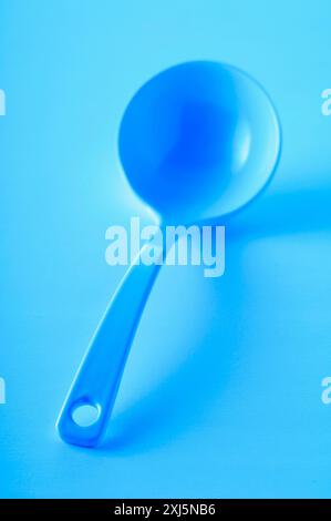 Blue plastic ladle Stock Photo - Alamy