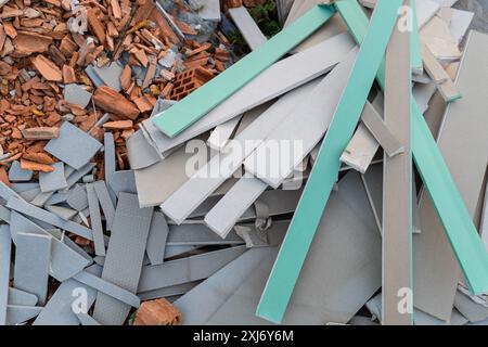 Different construction waste pieces of floor tiles, ceramic bricks ...