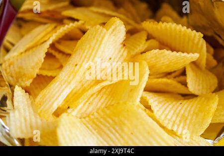 Potato chips in open snack bag close up Stock Photo - Alamy