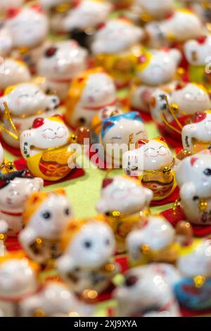 Traditional Waving Cat Statues, Also Known as Maneki-neko Stock Photo ...