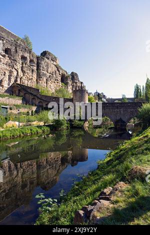 Old 18th century bridge across Afon Dwyfor River with St John's village ...