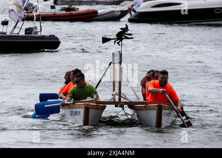 Mudeford RNLI fun day, charity event raft race in the harbour Stock ...