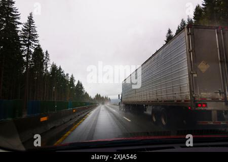 Driver's perspective through windshield of winter highway with semi ...