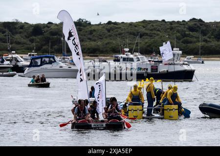 Mudeford RNLI fun day, charity event raft race in the harbour Stock ...