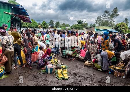 Busy African open market offering vegetables, wooden products and ...