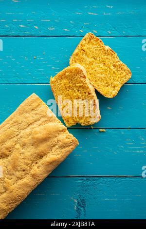 Homemade Sliced Cornbread Ready to Eat on a white plate, top view. Flat ...