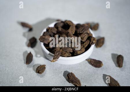 Black Cardamom - Kali Ilayachi - Badi Elaichi is placed on bowl Stock ...