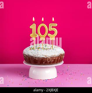 Pink number 105 birthday candle on white background Stock Photo - Alamy