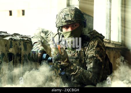 Soldier using radio in building during military operation Stock Photo ...