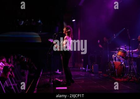 Kate Pillsbury of The Crane Wives plays guitar and sings live on stage ...