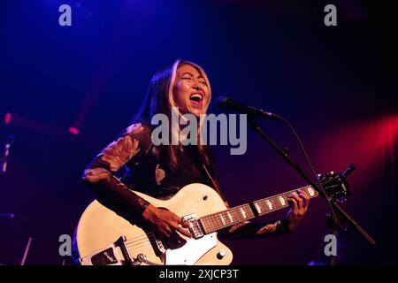 Kate Pillsbury of The Crane Wives plays guitar and sings live on stage ...