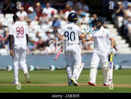 England’s Ben Duckett (right) and Ollie Pope (left) run between the ...