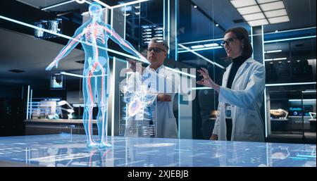 Two Bioengineers Working With Computer-Powered VFX Hologram Of Human ...