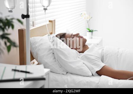 Coma patient. Young man sleeping in hospital bed Stock Photo - Alamy