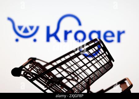 In this photo illustration, the Kroger company logo is seen displayed ...