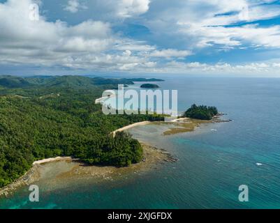 Aerial view of Borneo island covered with rainforest and sandy beach ...