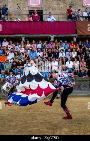 Young Men of The Istrice Contrada Put On A Flag Waving and Throwing ...