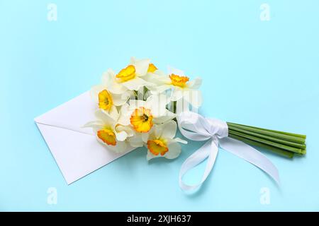 Beautiful bouquet of daffodil flowers with an envelope, greeting card ...