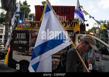 A man passing in front of a slogan at the Office of Unite trade union ...
