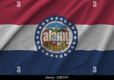 Missouri US state flag depicted on folded wavy fabric of old cloth ...
