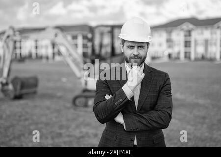 photo of positive civil engineering supervisor wearing hardhat. civil ...