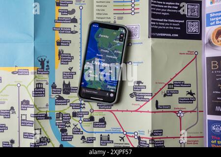 Liverpool paper tourist map and iPhone map Stock Photo - Alamy