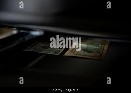 Using a copy machine to print forgery currency Stock Photo - Alamy