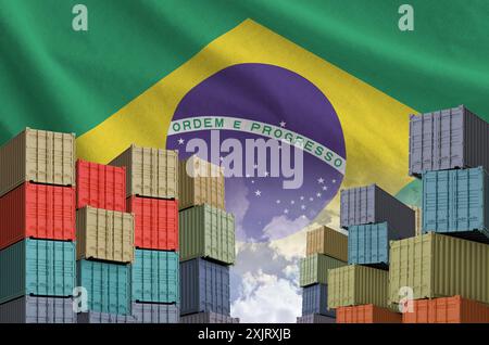 Brazil flag and big stack of shipping cargo containers in docks with ...