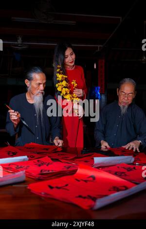 Vietnamese scholar writes calligraphy at lunar new year calligraphy ...
