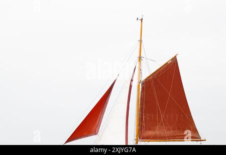 Sailing ship boom and gaff, gaff rigged, with furled sail and masts ...