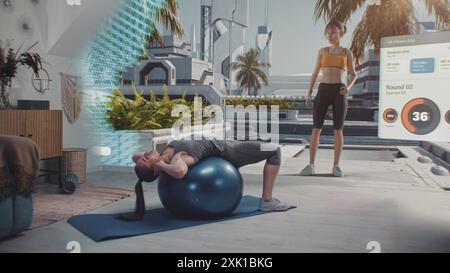 Female athlete exercises with fitball. VR screen with displayed virtual ...