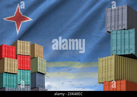 Aruba flag and big stack of shipping cargo containers in docks with sky ...