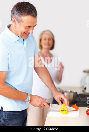 Senior man smiling confident cutting datil at kitchen Stock Photo - Alamy
