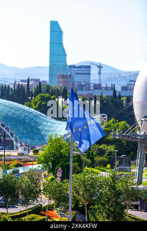 European union flag waving against blue sky Stock Photo - Alamy