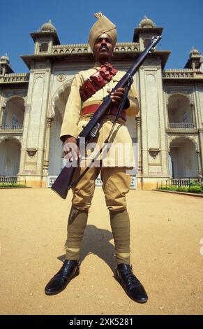 a guard at the Mysore Palace or Amba Vilas Palace in the city of Mysore ...