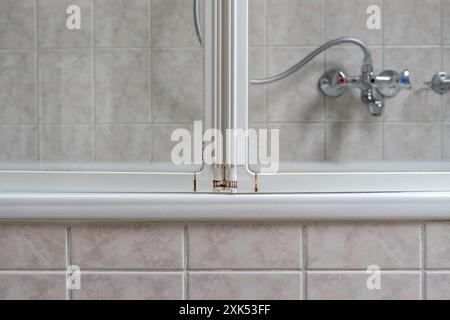 folding bath screen on bathtub Stock Photo - Alamy