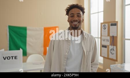 Young american voter smiling happy putting vote in ballot box at ...