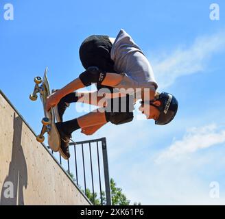 Skateboarder performing stunt on Vert Ramp Stock Photo - Alamy