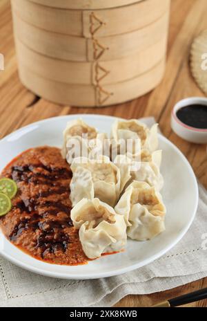 Steamed Mackerel Dumplings on Plate with Dipping Sauce Stock Photo - Alamy