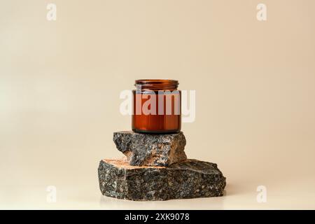 Glass Jar On Stacked Rocks Against Beige Background Stock Photo - Alamy