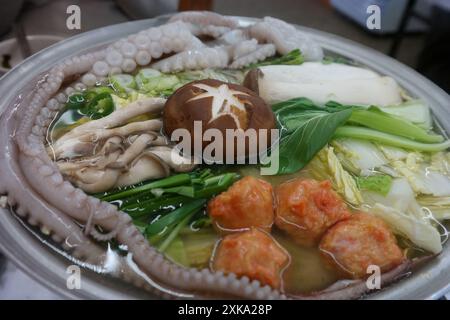 Korean style hot pot with octopus, mushrooms and vegetables Stock Photo ...
