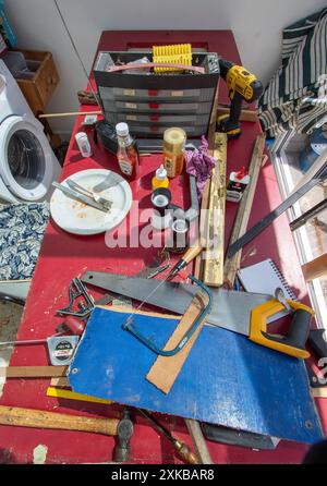 Improvised table top to eat breakfast on adark red door being repaired ...