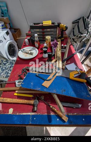Improvised table top to eat breakfast on adark red door being repaired ...