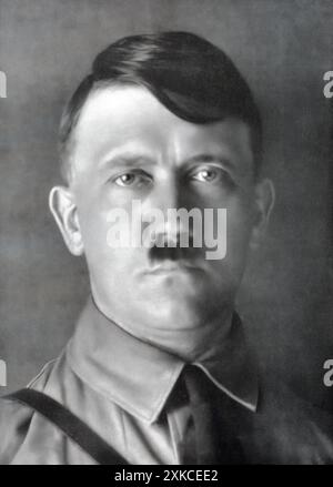 A historical photograph of Adolf Hitler speaking at a rally ...