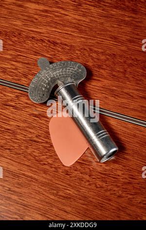 Vintage Variable metal chromatic guitar tuning pitch pipes resting on ...