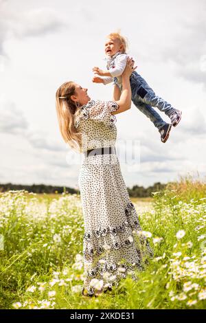 Young mother walking with her little son outdoors in autumn Stock Photo - Alamy