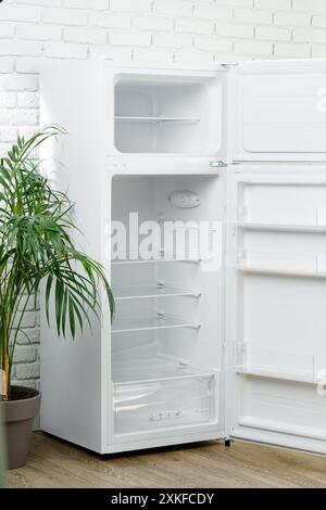 White Refrigerator Open Against Brick Wall Stock Photo - Alamy