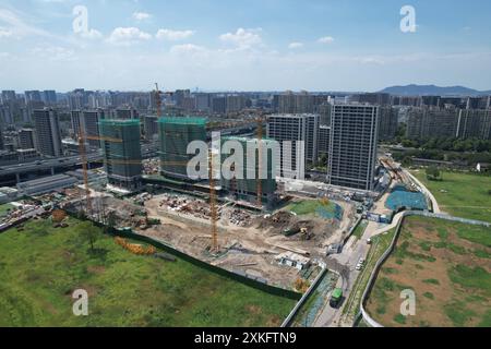 HANGZHOU, CHINA - JULY 23, 2024 - A building under construction and ...