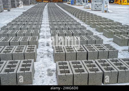 Rows of concrete cinder blocks, building material in form of gray ...
