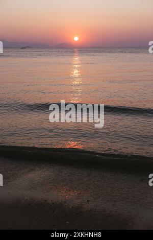 Sunset on the beach in Huizhou China Stock Photo - Alamy